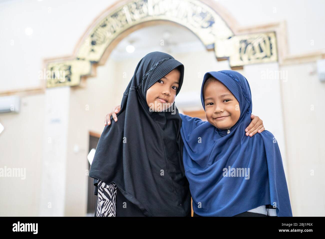 two kids bestfriend muslim while on the mosque Stock Photo - Alamy