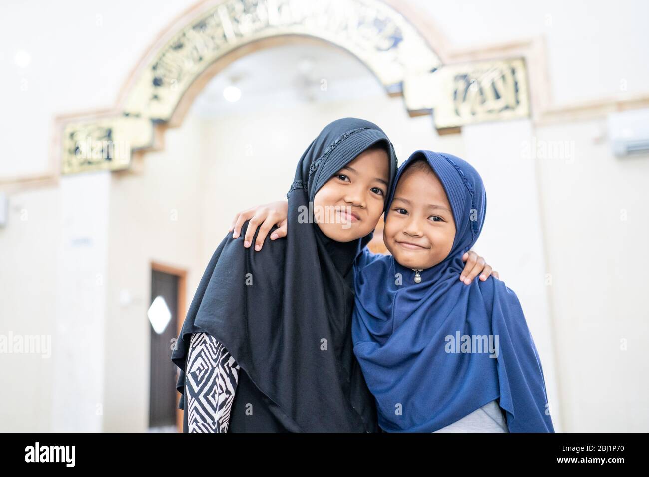 two kids bestfriend muslim while on the mosque Stock Photo - Alamy