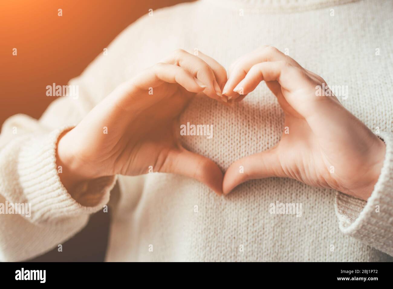 Female hands in the form of heart Stock Photo - Alamy