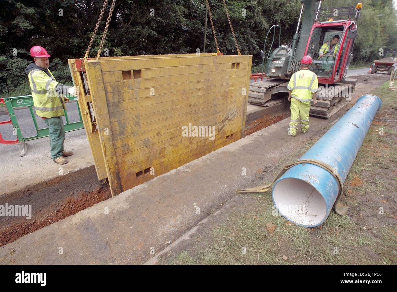 Installing a new water main A217 Burgh Heath, Surrey. Health and Safety ...