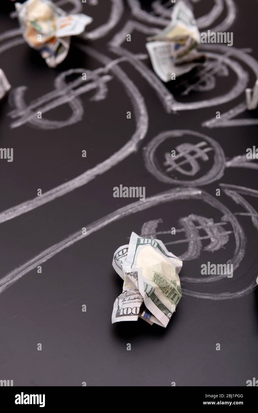 Chalk money tree with crumpled dollars drawing on blackboard background ...