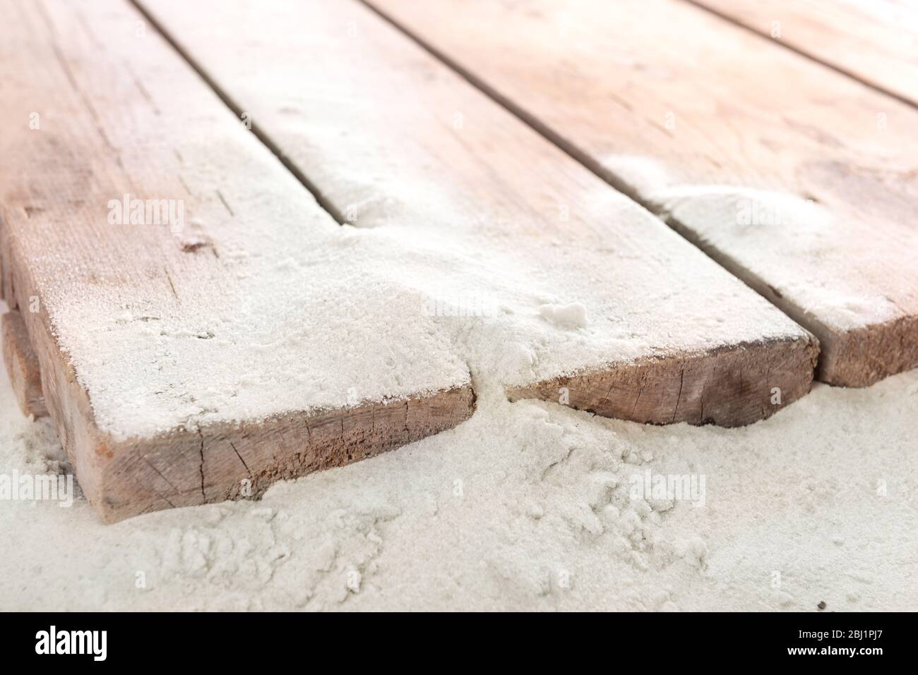 Sand with wooden planks, closeup Stock Photo - Alamy