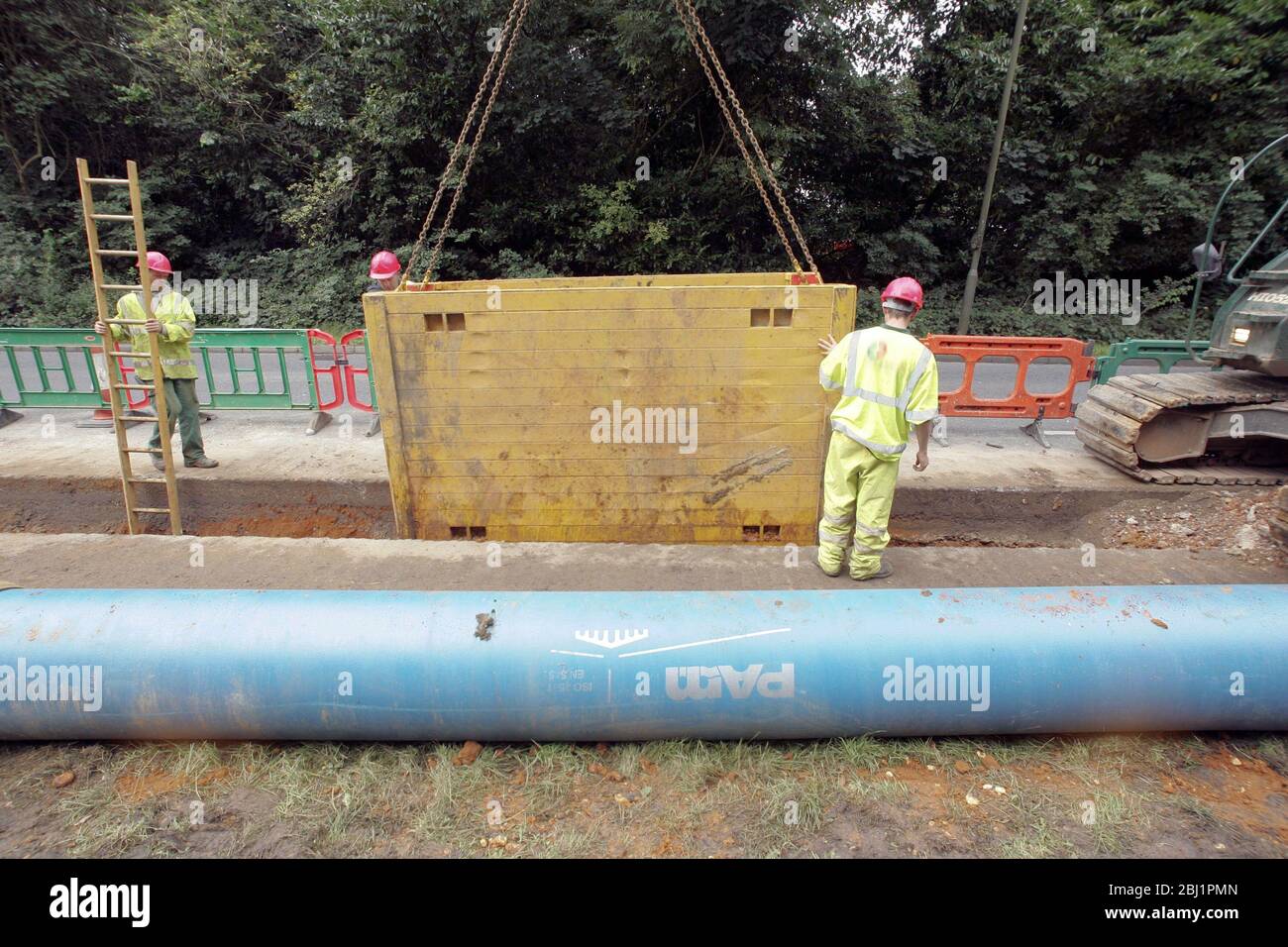 Installing a new water main A217 Burgh Heath, Surrey. Health and Safety ...