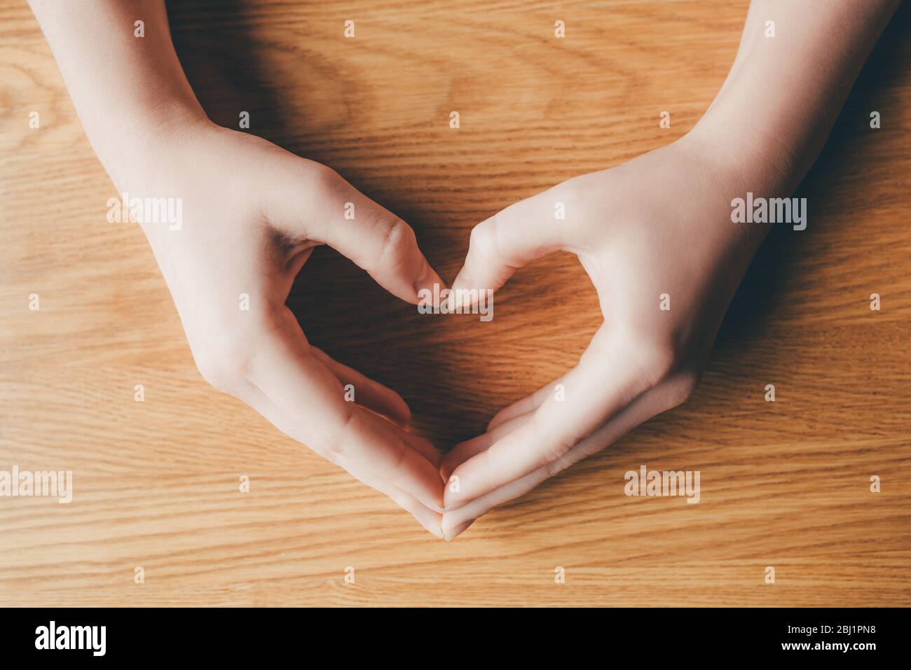 Female hands in the form of heart Stock Photo - Alamy