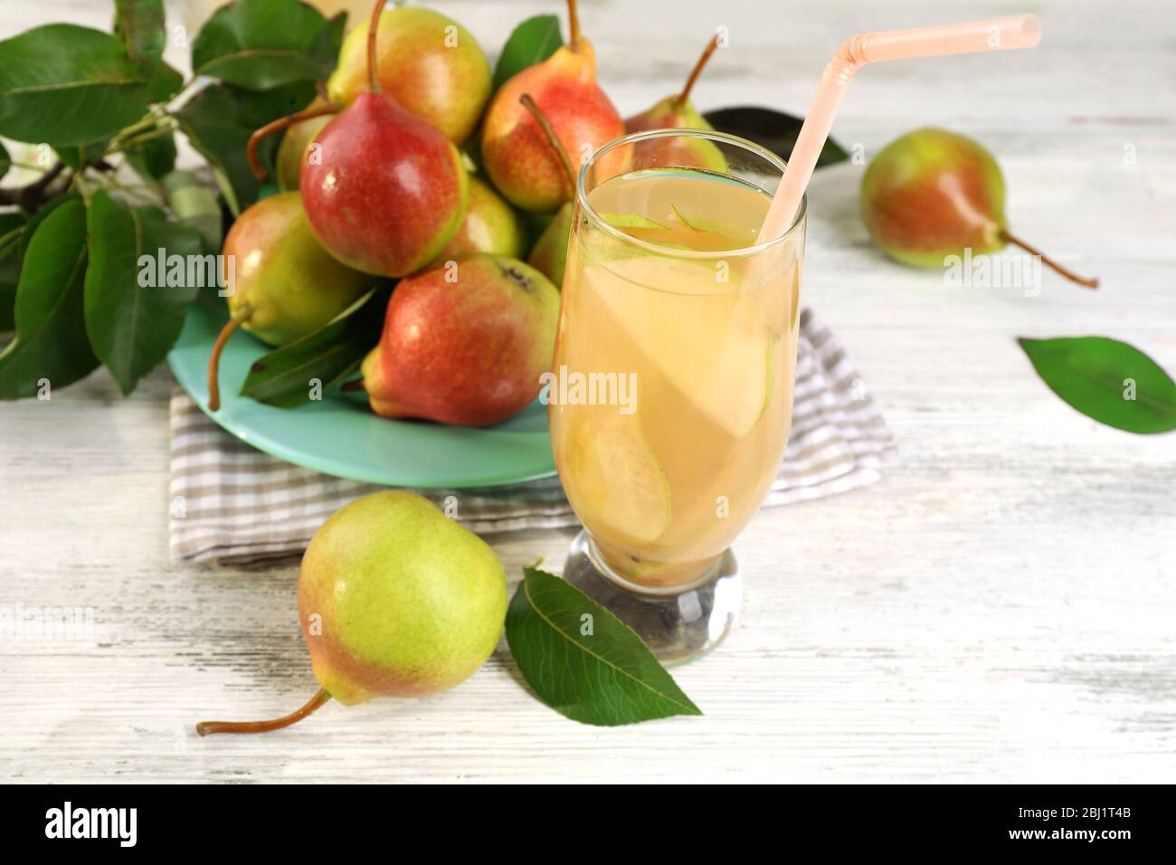 Fresh pear juice with fruit on table close up Stock Photo - Alamy