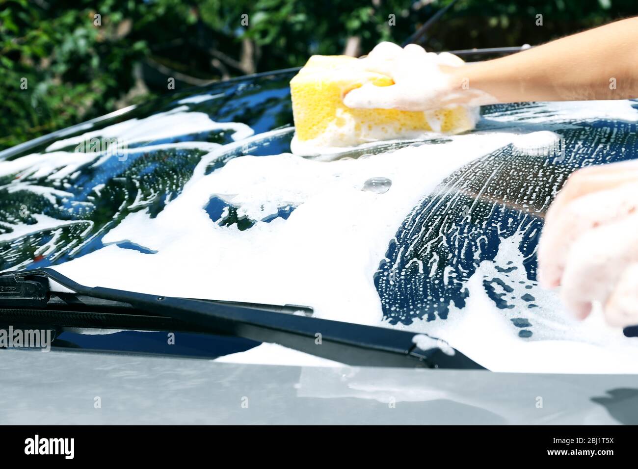 Hand washing car window Stock Photo - Alamy