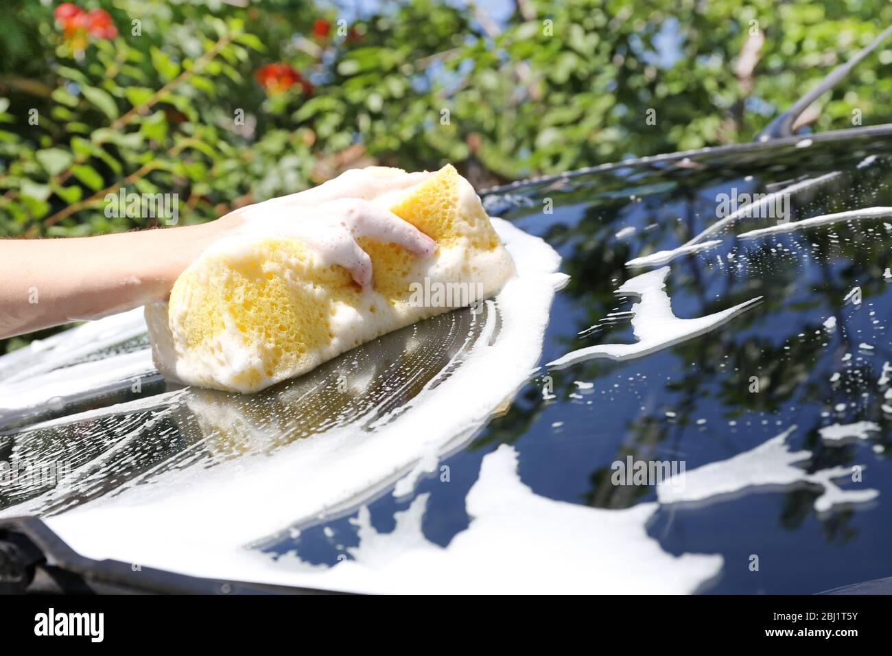 Hand washing car window Stock Photo - Alamy