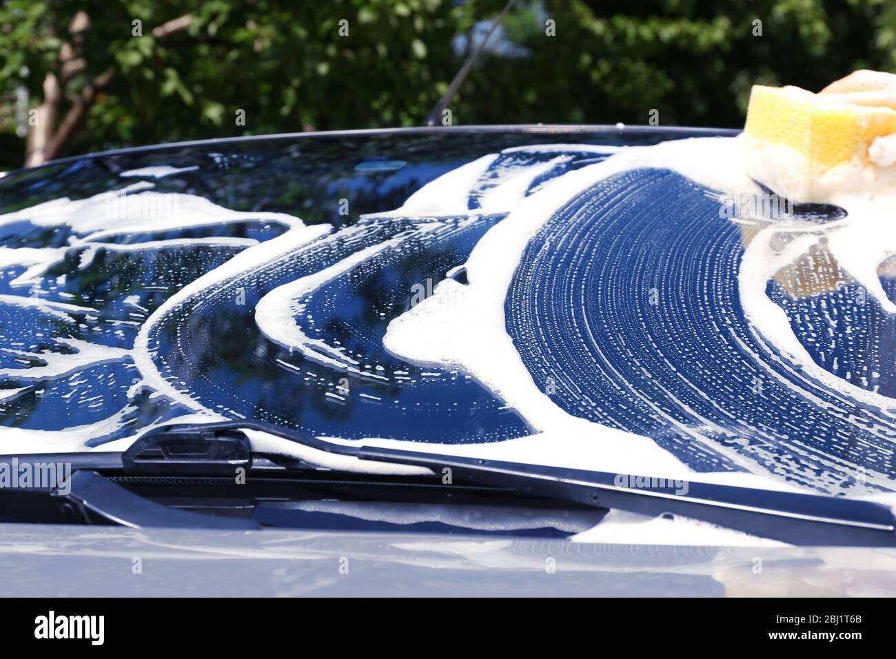 Hand washing car window Stock Photo - Alamy