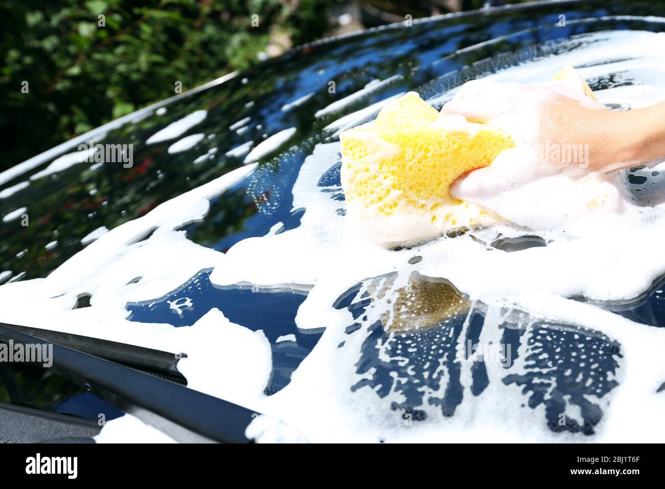 Hand washing car window Stock Photo - Alamy
