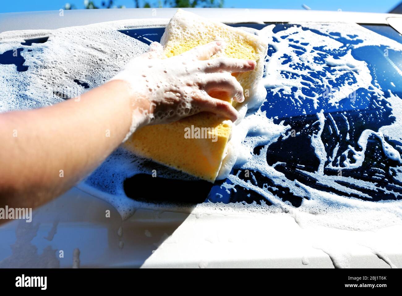 Hand washing car window Stock Photo - Alamy