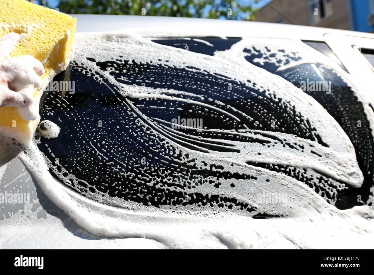 Hand washing car window Stock Photo - Alamy