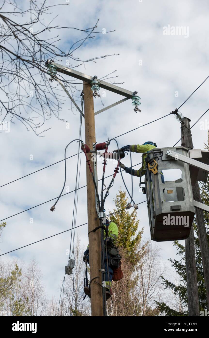 Men Repairing Powerlines Stock Photo - Alamy