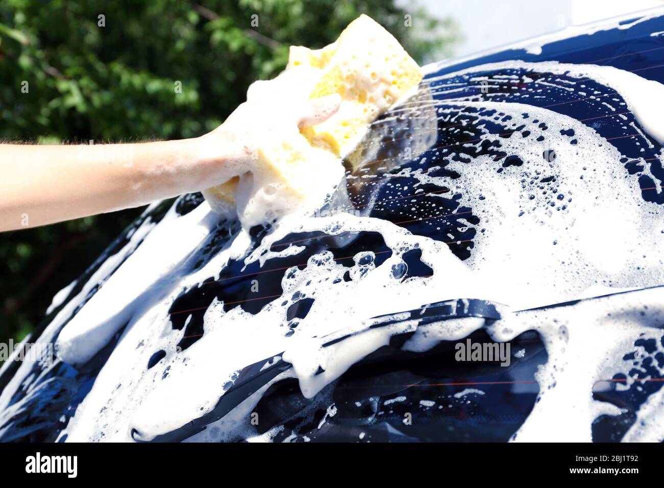 Hand washing car window Stock Photo - Alamy