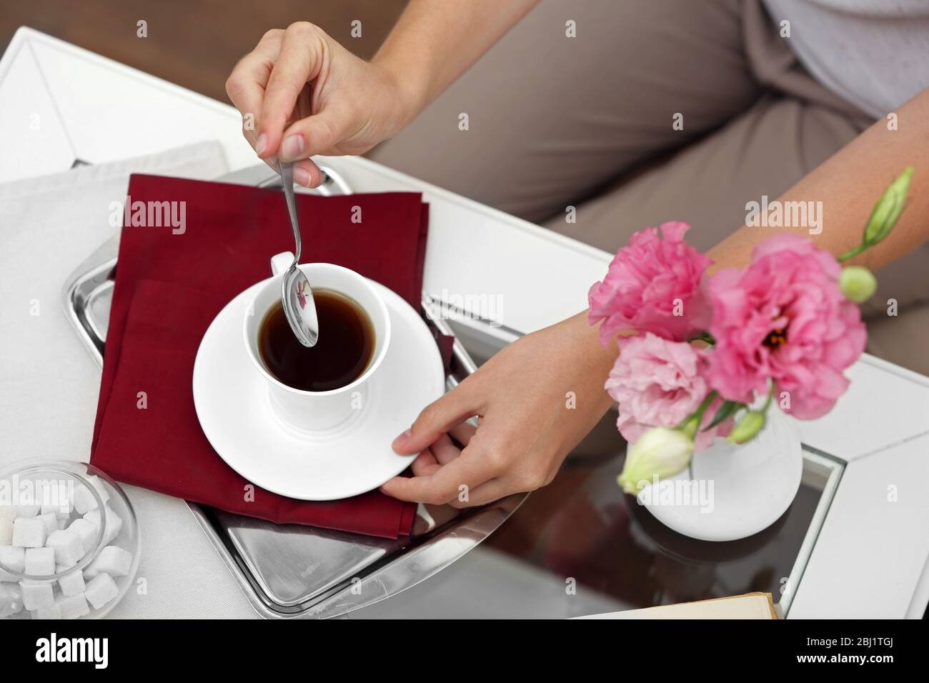 Woman hand decorating cup tea hi-res stock photography and images - Alamy