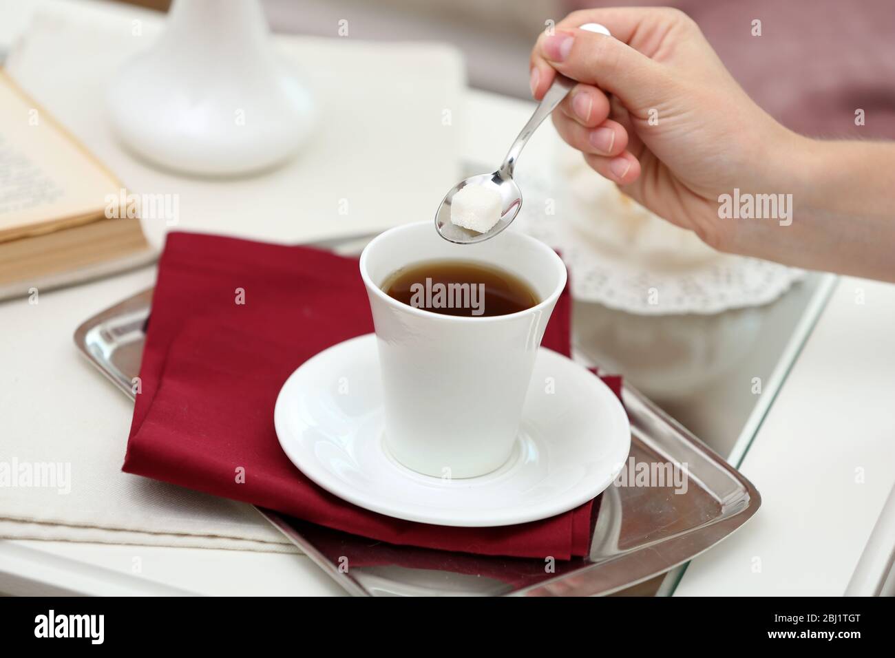 Female hand pours sugar hi-res stock photography and images - Alamy