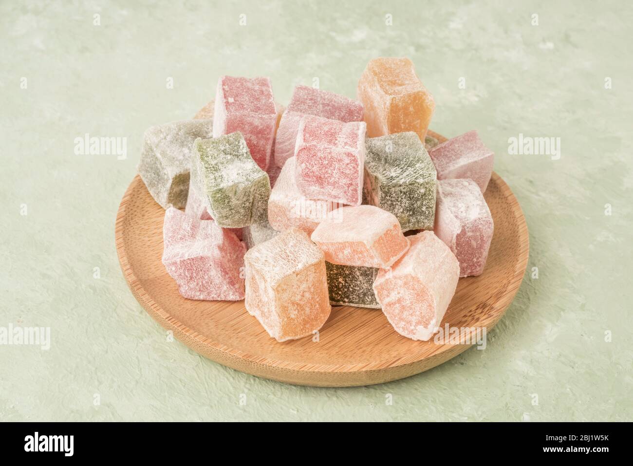 Closeup colorful assortment of Turkish delights on a green background ...