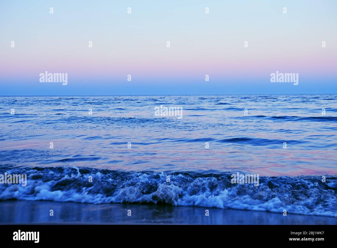 View of beautiful sunset on the beach Stock Photo - Alamy