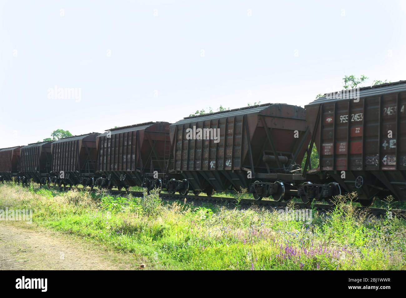 Freight train on railroad Stock Photo - Alamy