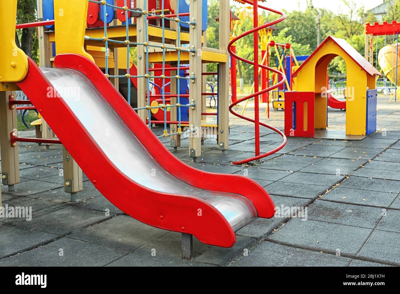 Colorful children playground in park Stock Photo - Alamy