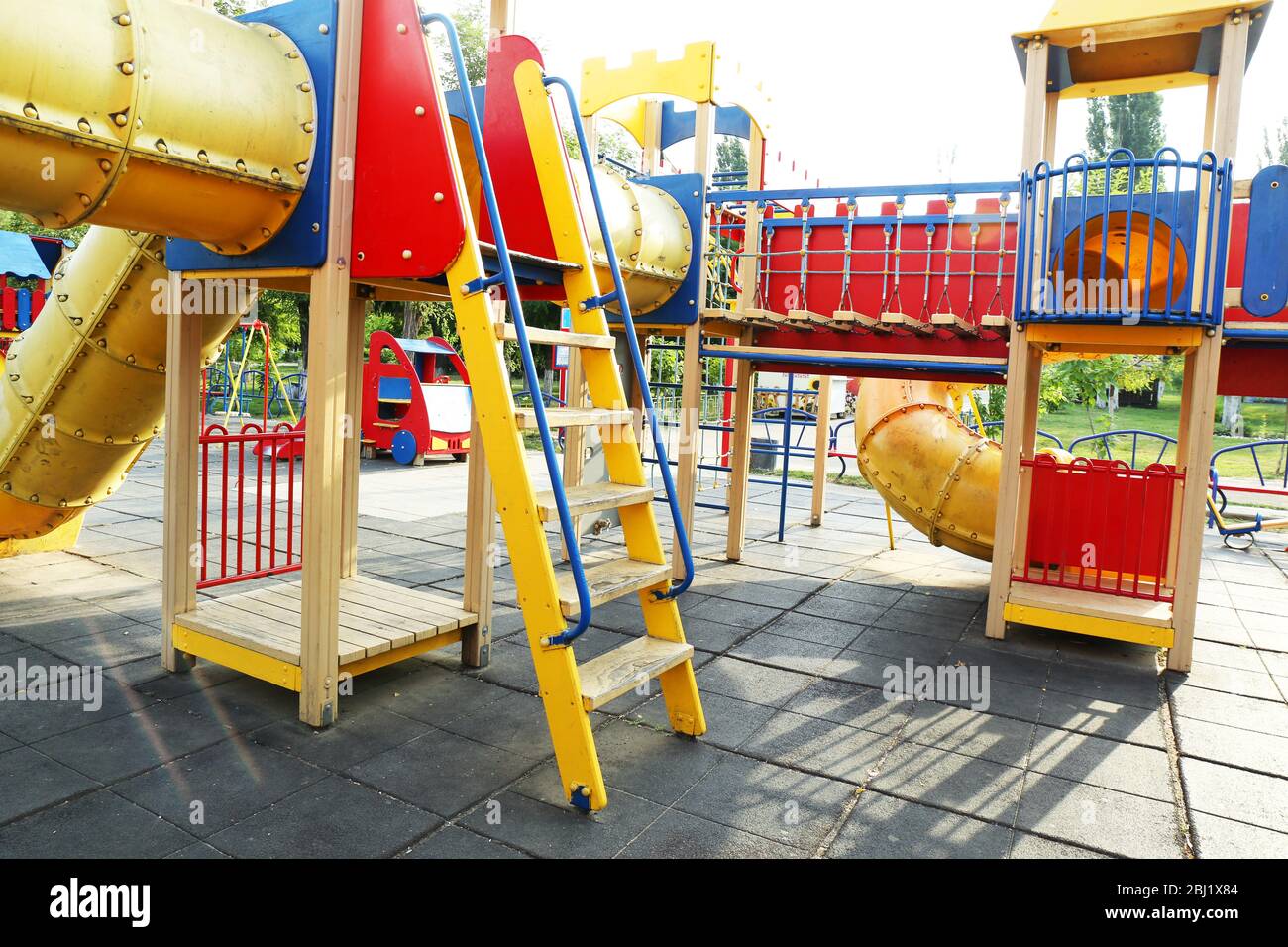 Colorful children playground in park Stock Photo - Alamy