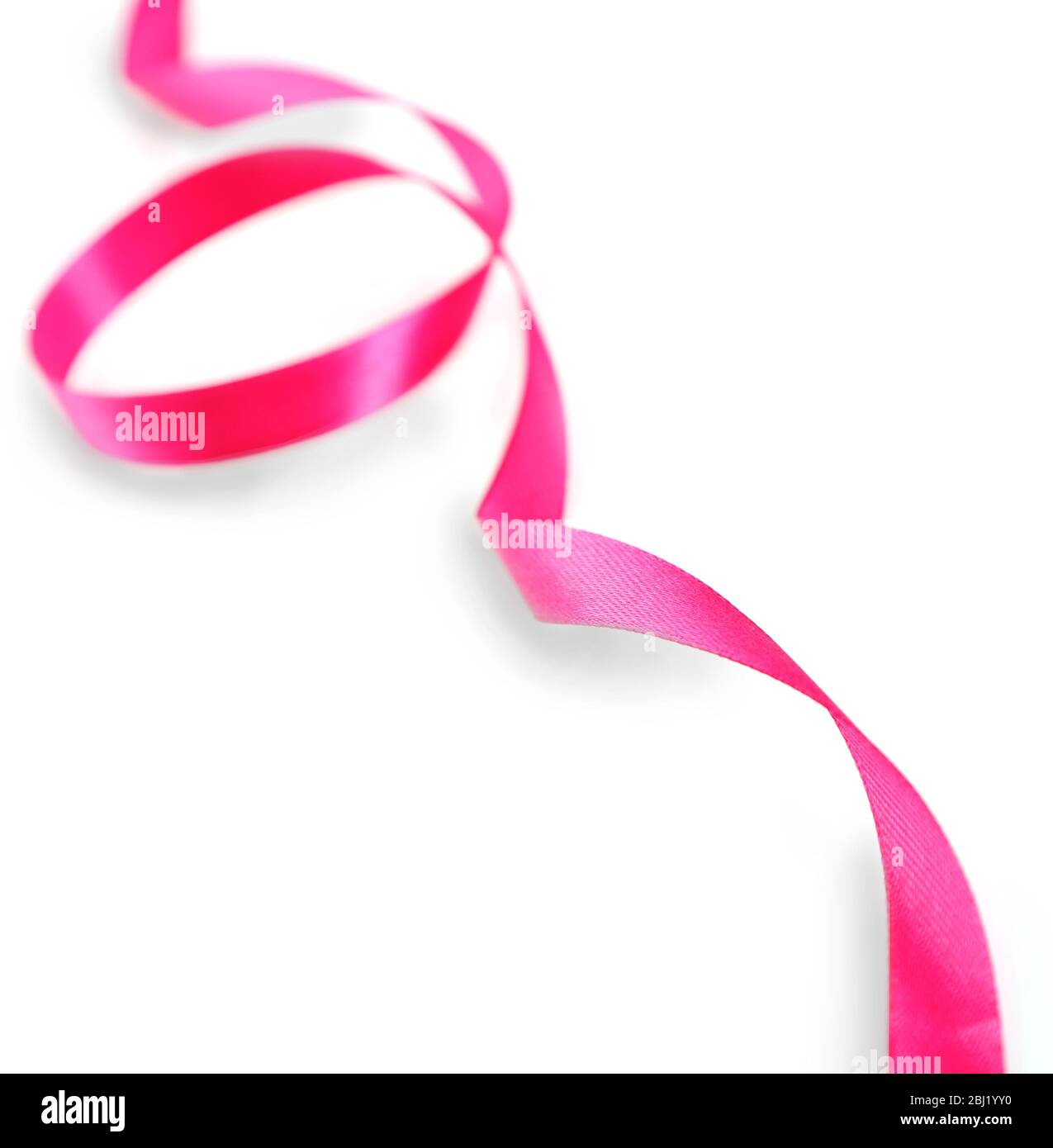 Pink curly ribbon isolated on white Stock Photo - Alamy