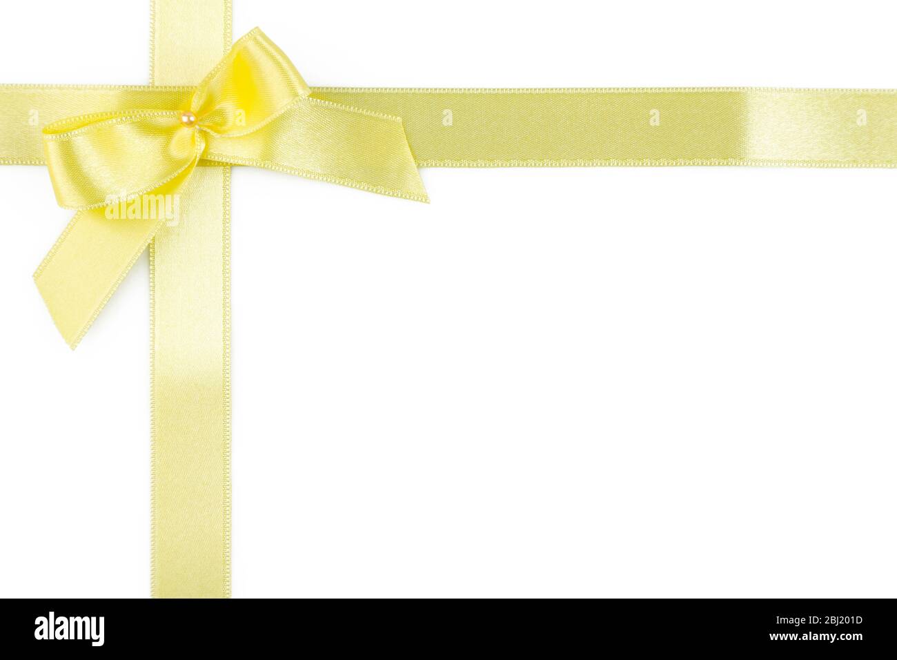 Yellow ribbon bow isolated on white Stock Photo - Alamy