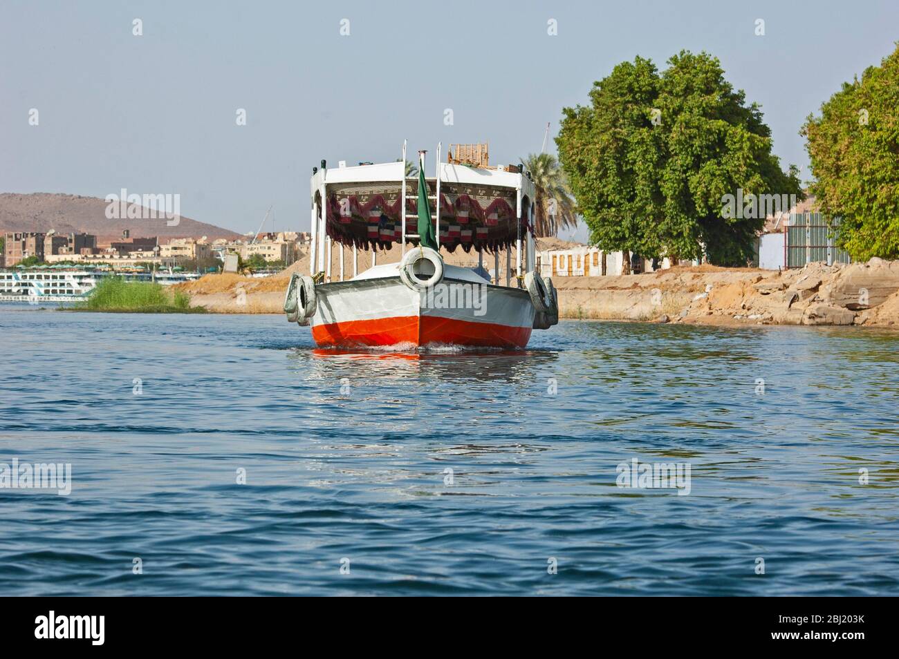 Traditional Egyptian felluca river boat on the Nile traveling through ...