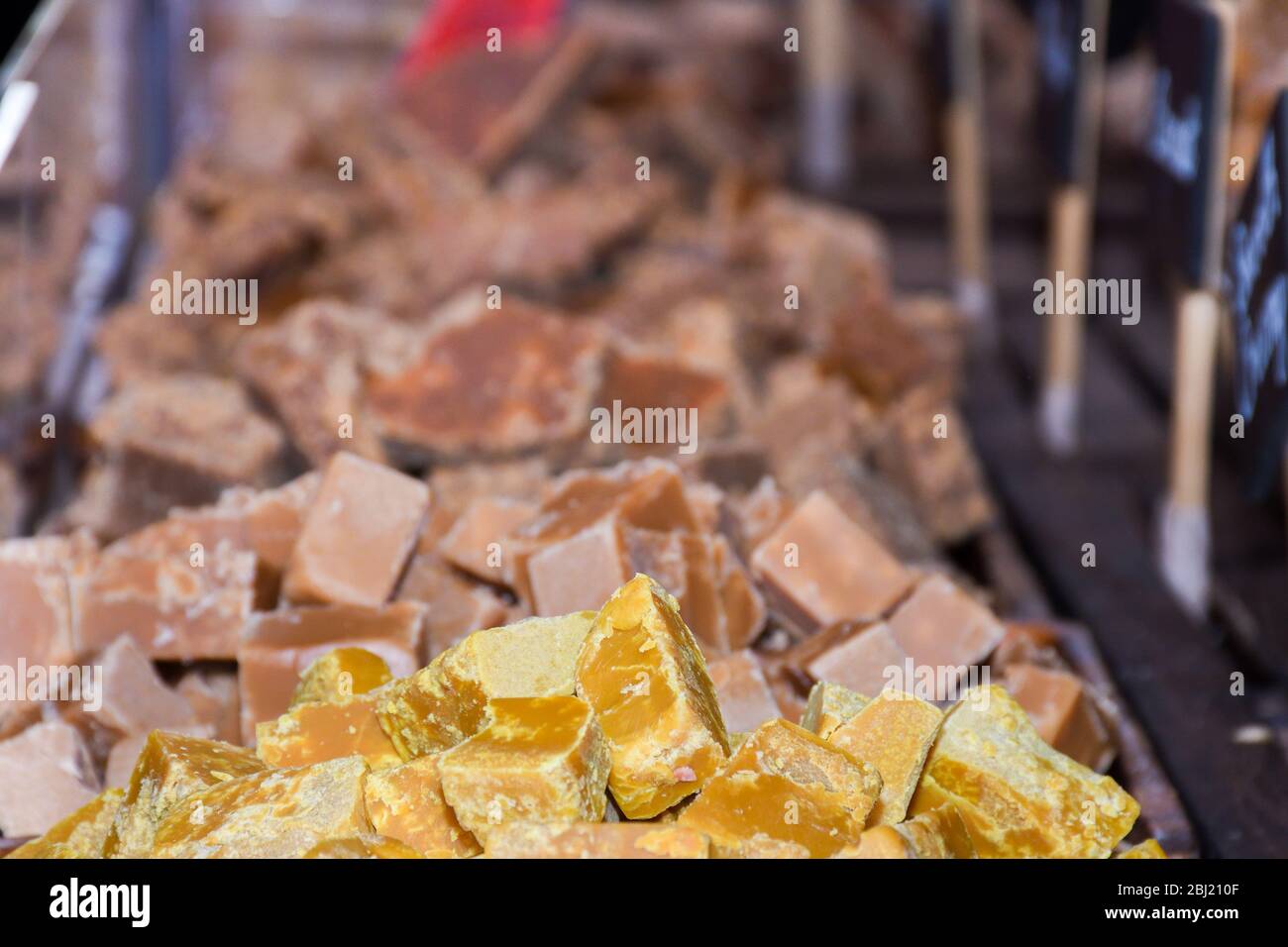 A stack of homemade caramel. Groups of caramel candy, isolated on the ...