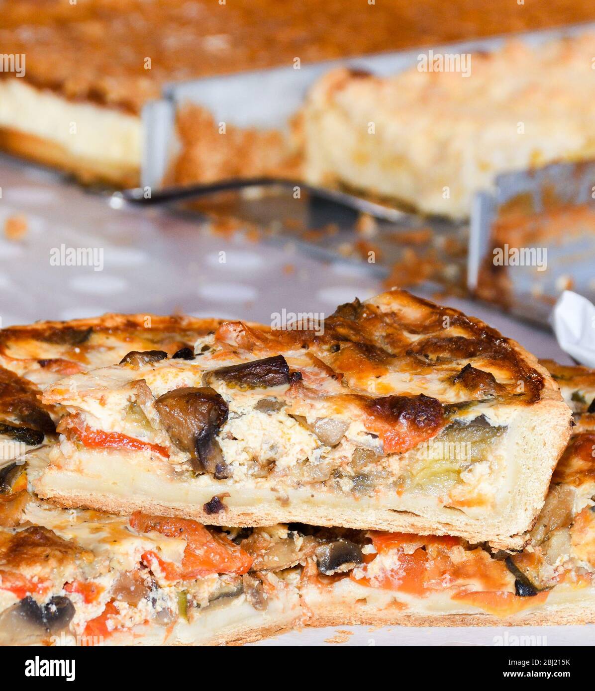 Quiche is a French tart consisting of pastry crust filled with savoury ...