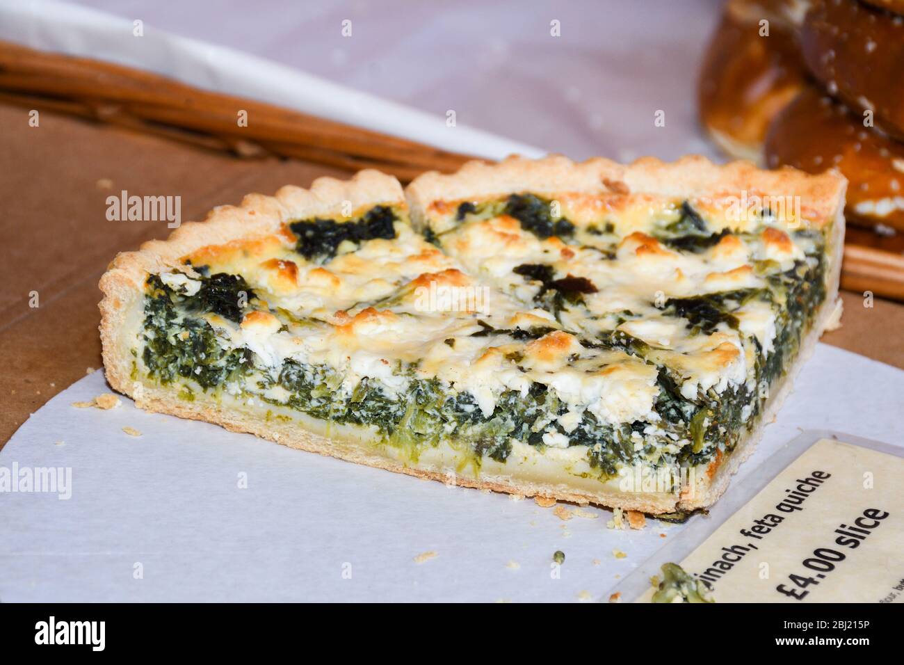 Quiche is a French tart consisting of pastry crust filled with savoury ...