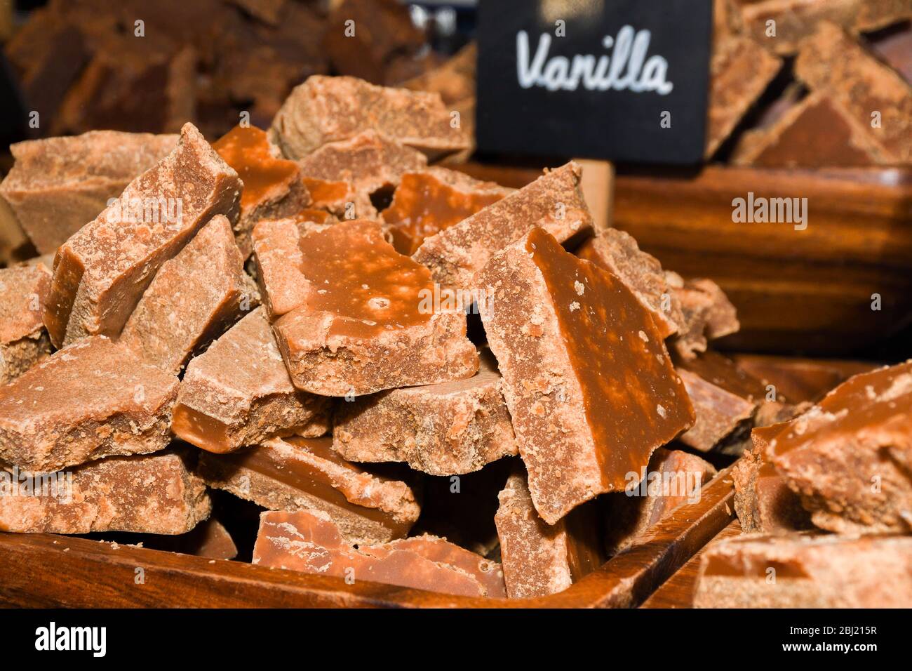 A stack of homemade caramel. Groups of caramel candy, isolated on the ...