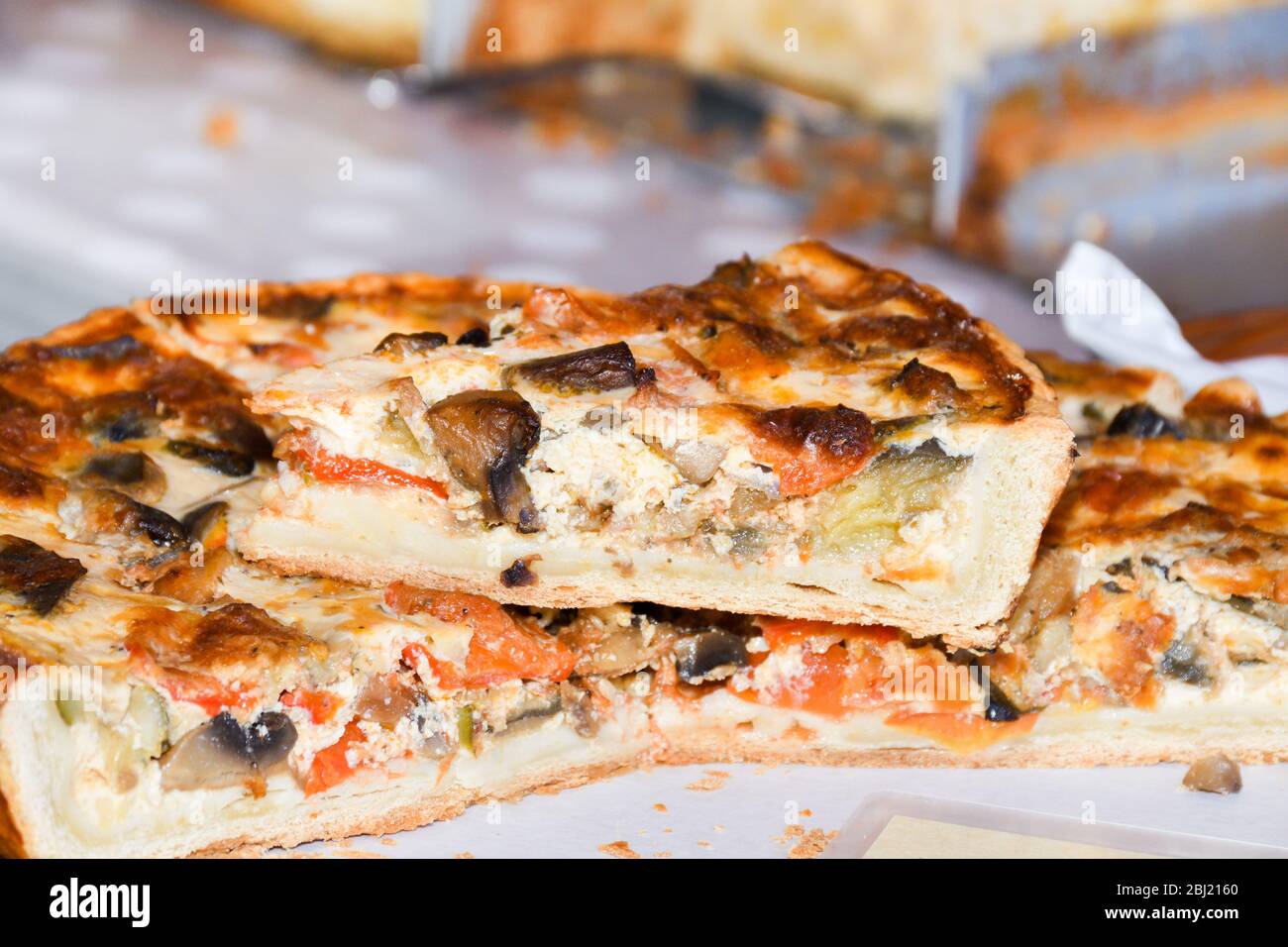 Quiche is a French tart consisting of pastry crust filled with savoury ...