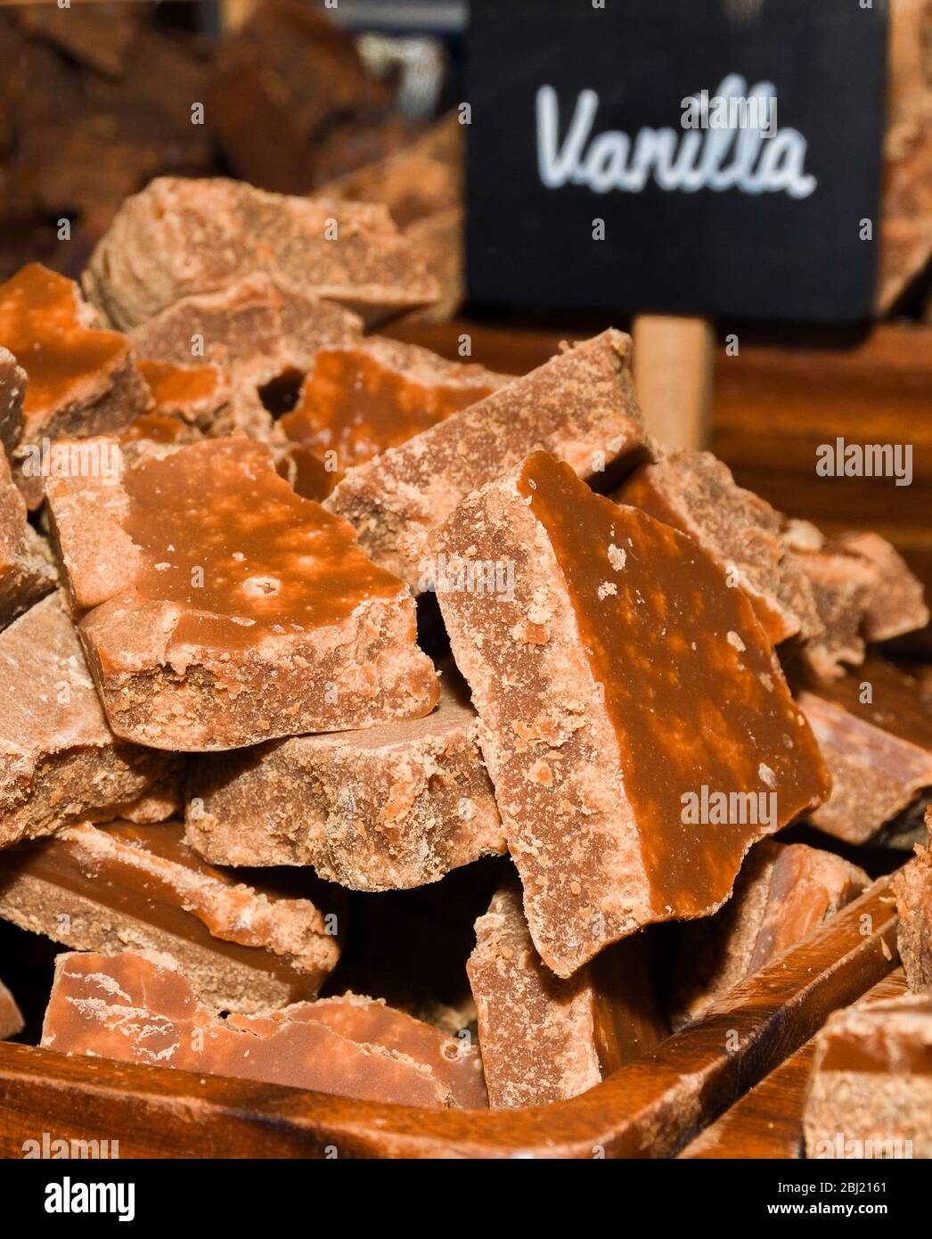 A stack of homemade caramel. Groups of caramel candy, isolated on the ...