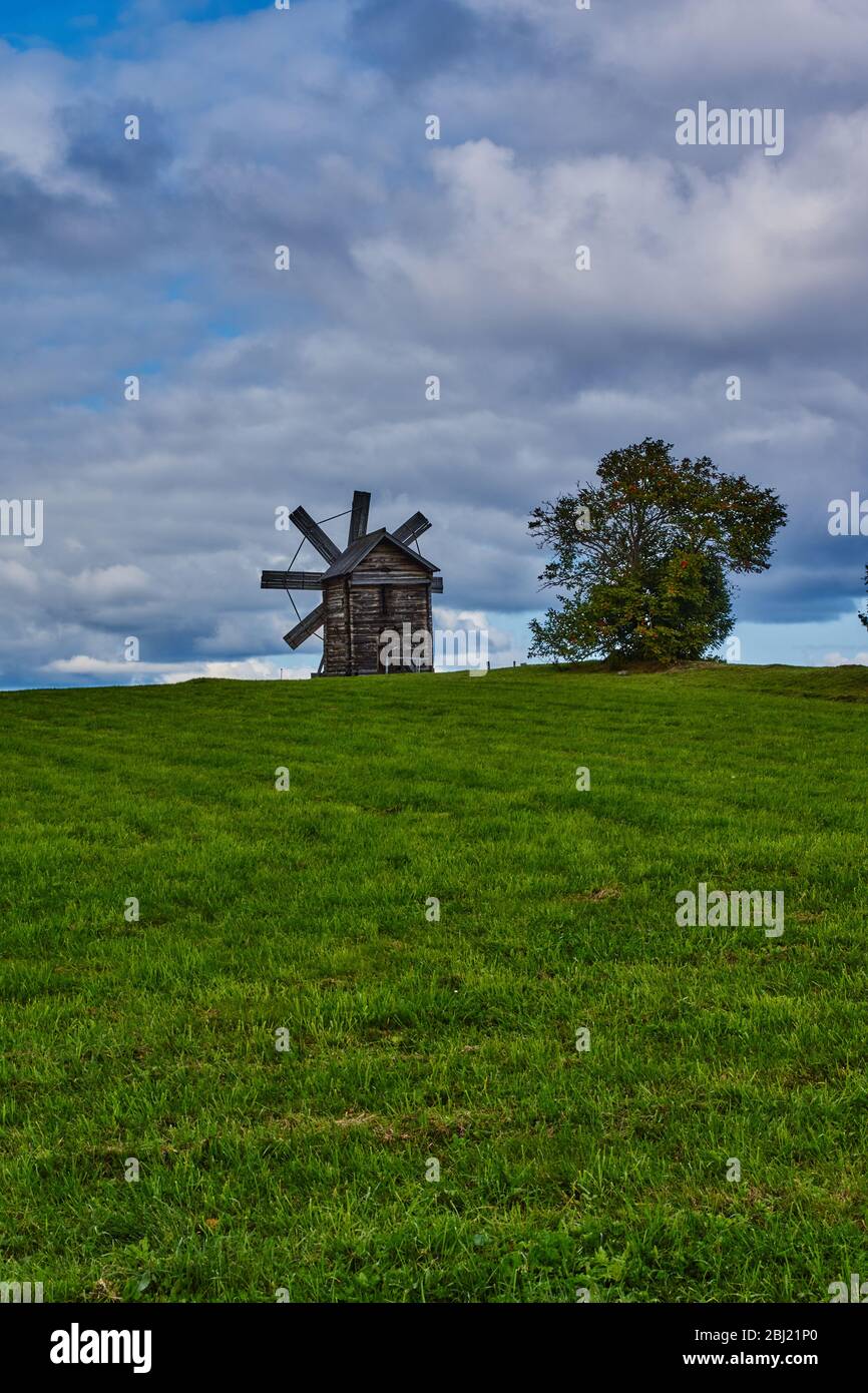 Antique windmill.Vintage windmill wooden mill with wind wheel blades ...