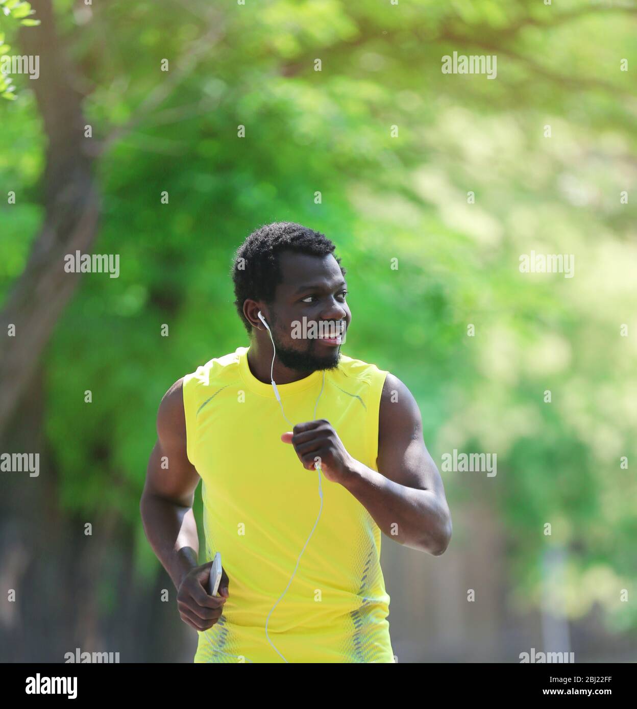 African american man running green hi-res stock photography and images ...