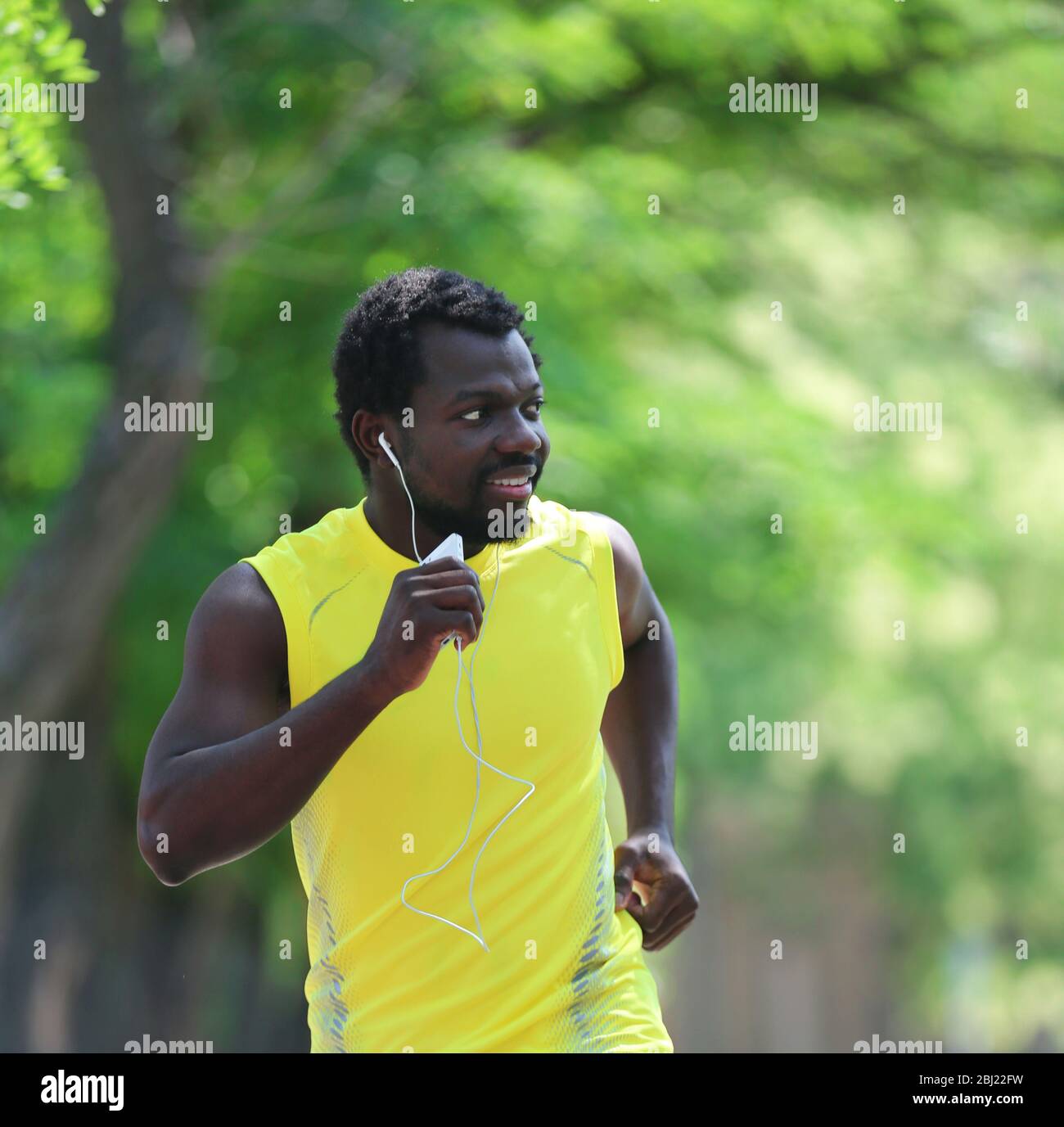 African american man running green hi-res stock photography and images ...