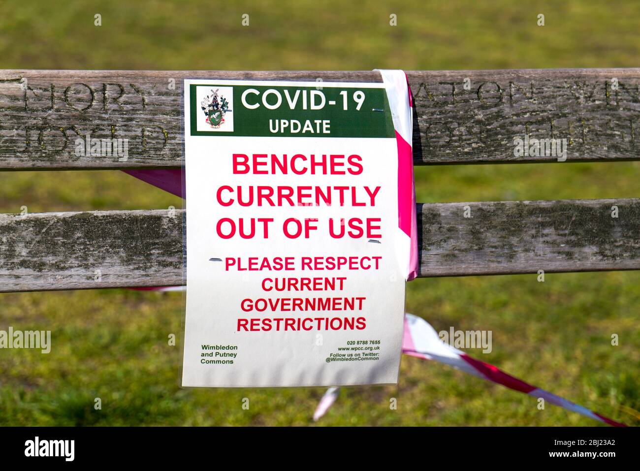 Sign on Wimbledon Common telling people not to sit on the benches ...