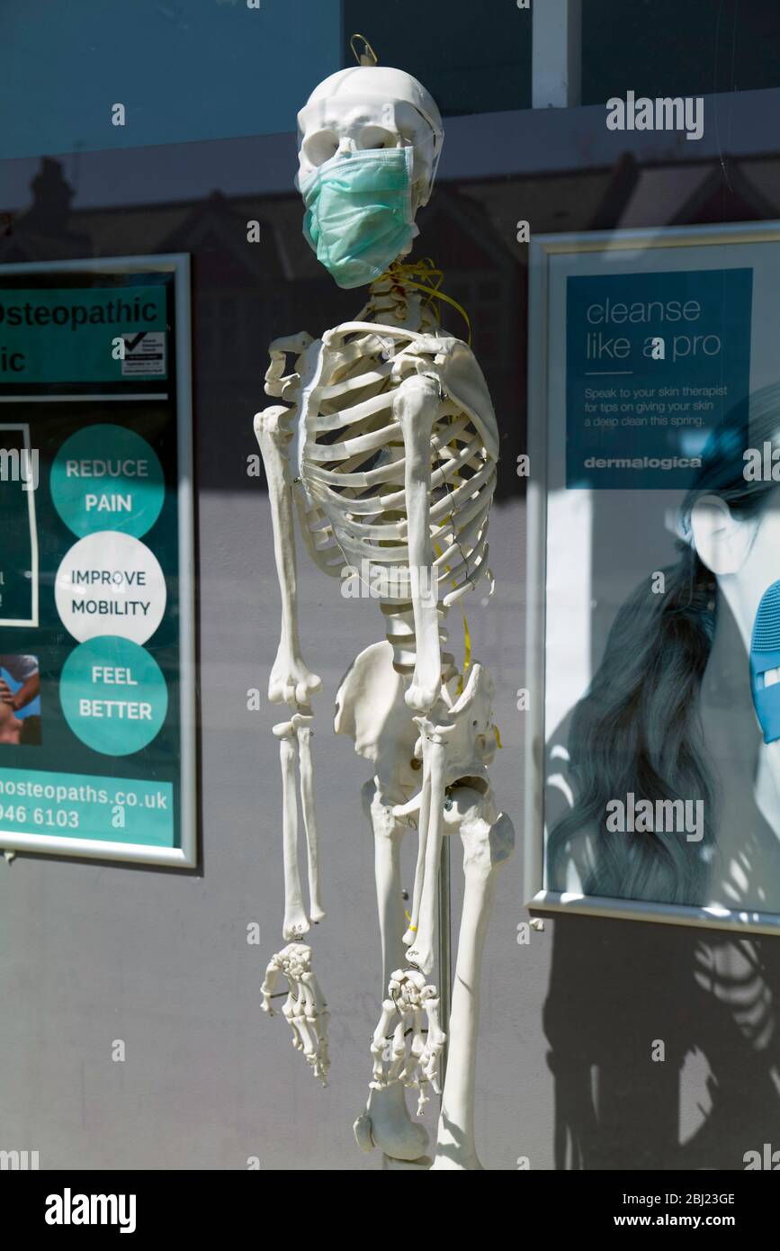 A skeleton in a shop wearing a face mask against a Coronavirus Stock ...