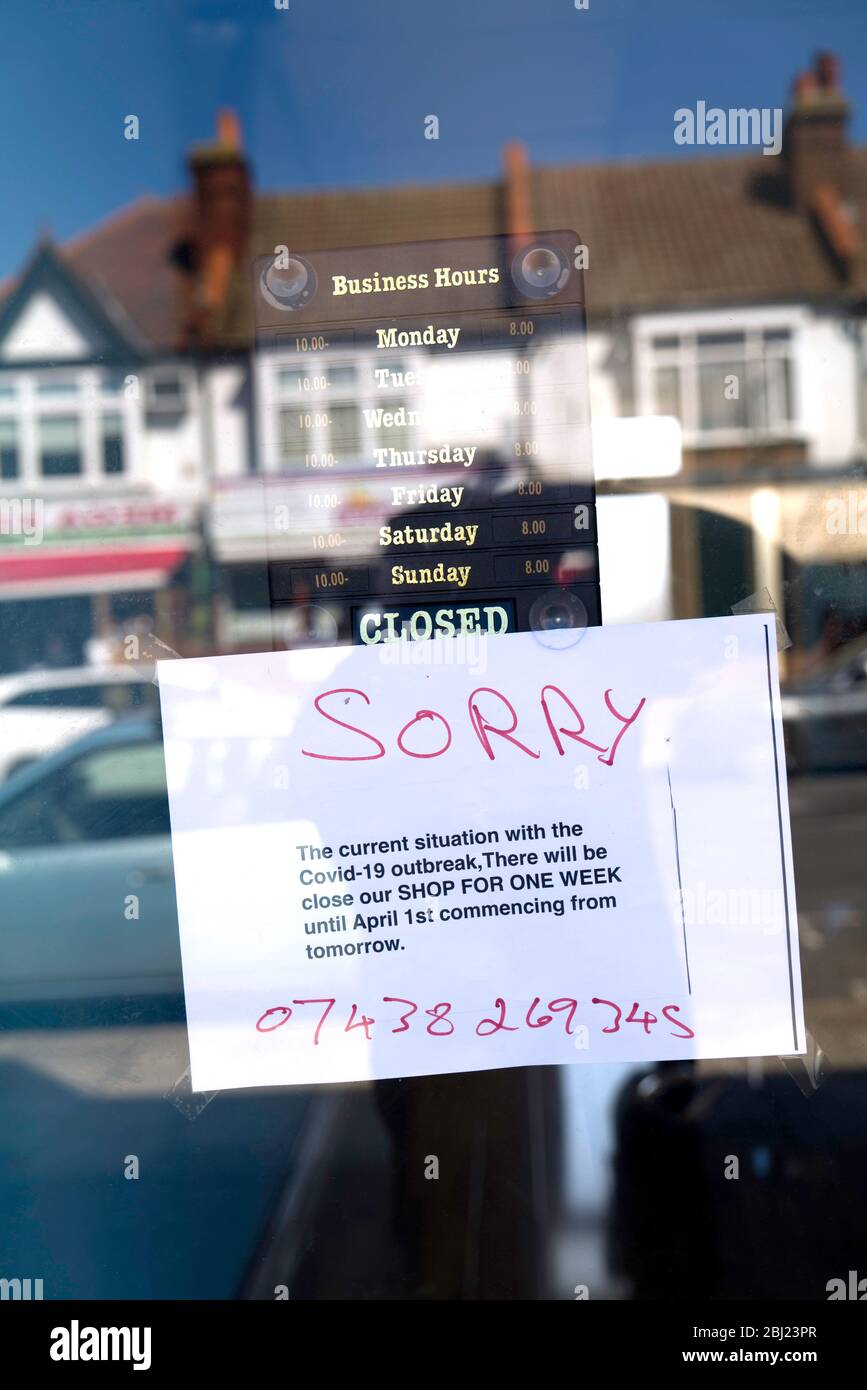 A Sorry sign informing customers that the shop is closed because of ...