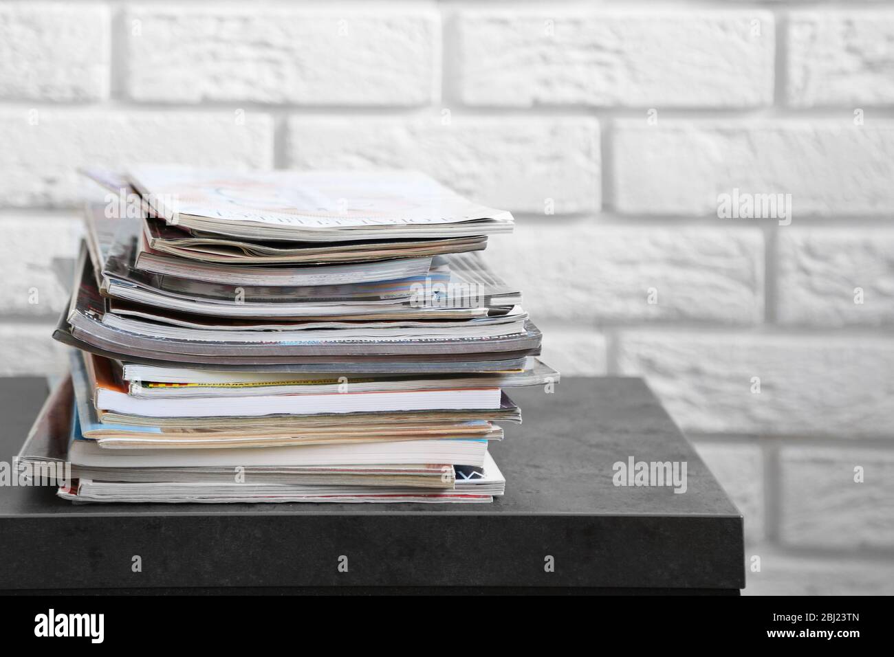 Stack of magazines on table, close up Stock Photo - Alamy
