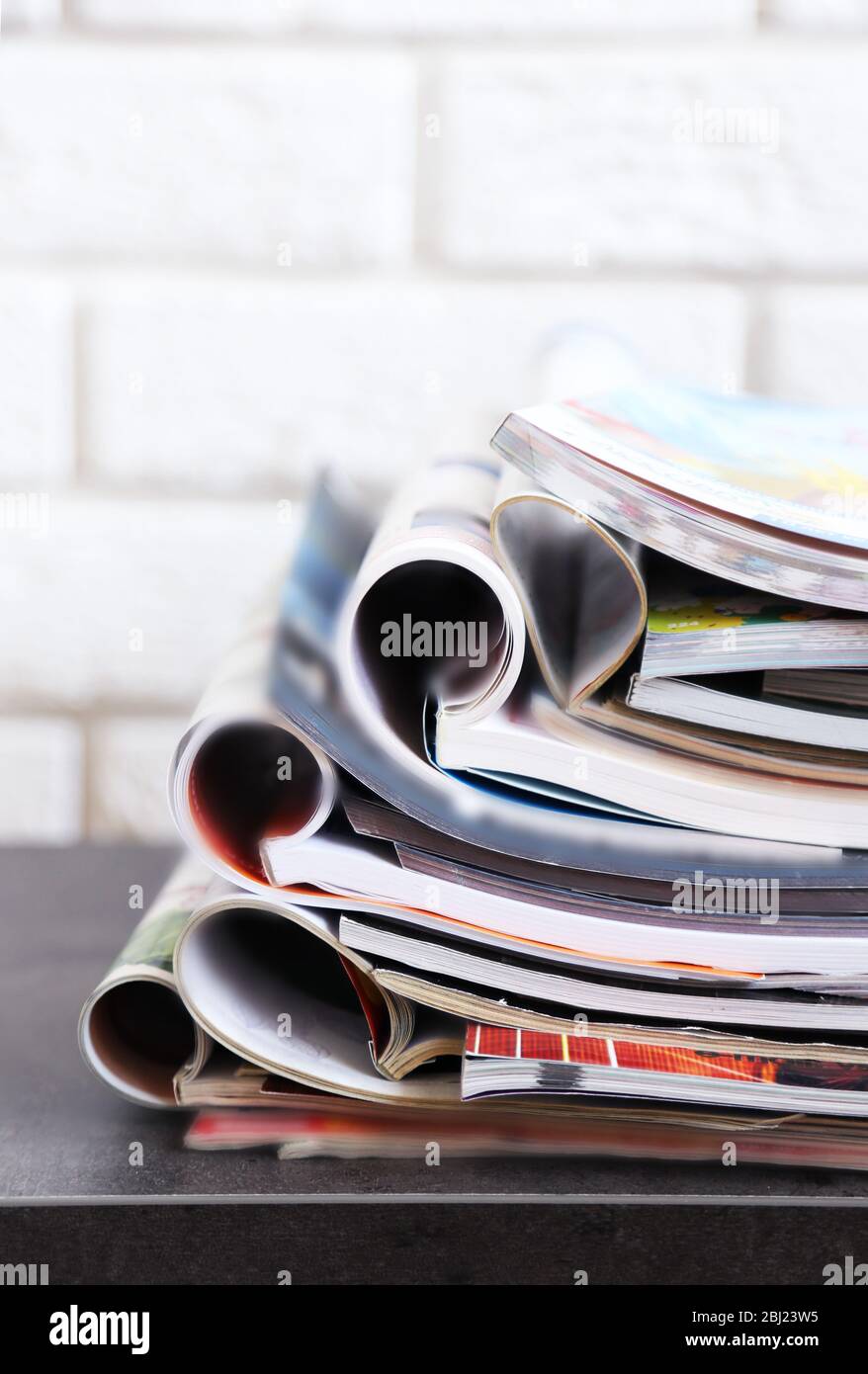 Stack of magazines on table, close up Stock Photo - Alamy