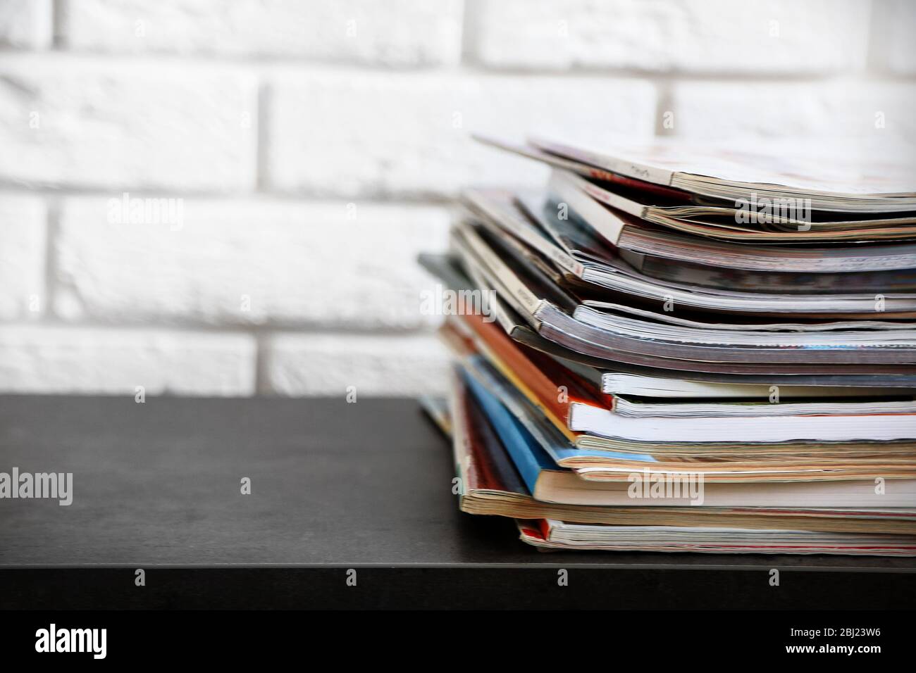 Stack of magazines on table, close up Stock Photo - Alamy