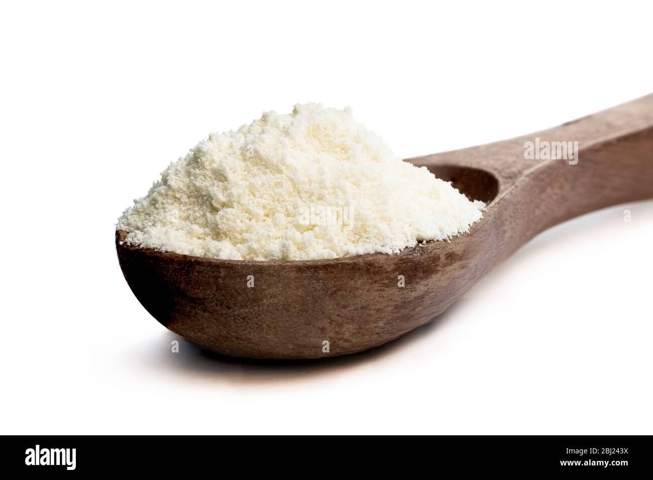 Full fat powdered milk in wooden spoon isolated on white Stock Photo ...