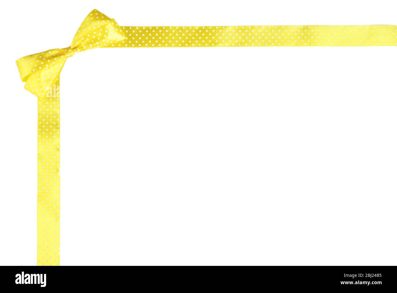 Yellow ribbon bow isolated on white Stock Photo - Alamy