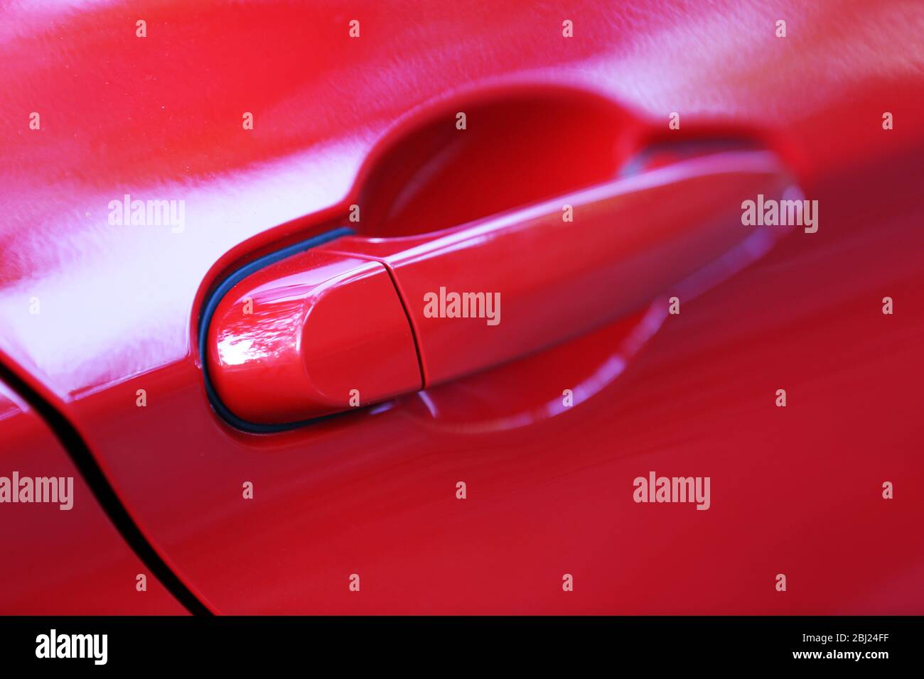 Door handle of red car Stock Photo - Alamy
