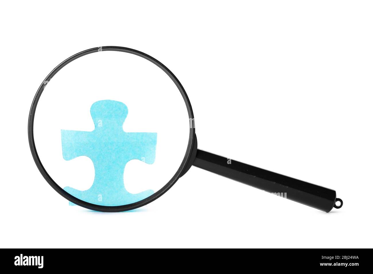 magnifying glass searching for missing puzzle pieces Stock Photo - Alamy