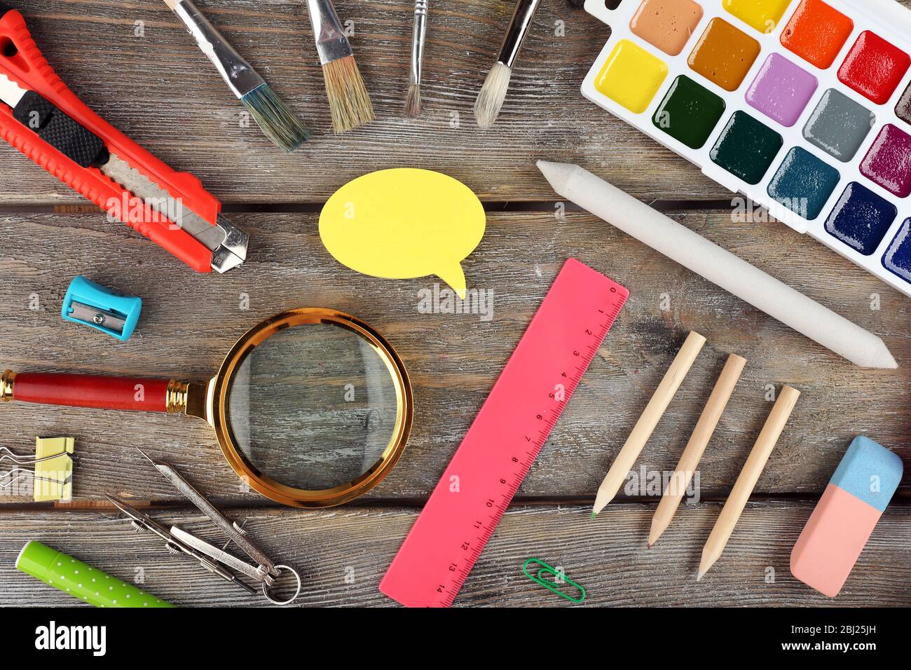 Bright stationery objects on wooden table close up Stock Photo - Alamy