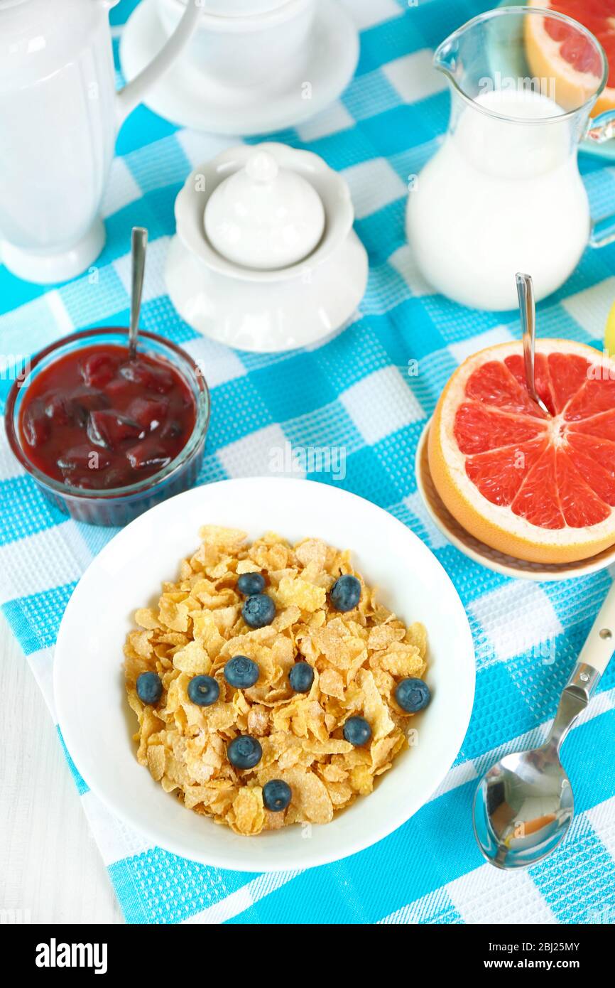 Tasty cornflakes with fruits and berries on table close up Stock Photo ...