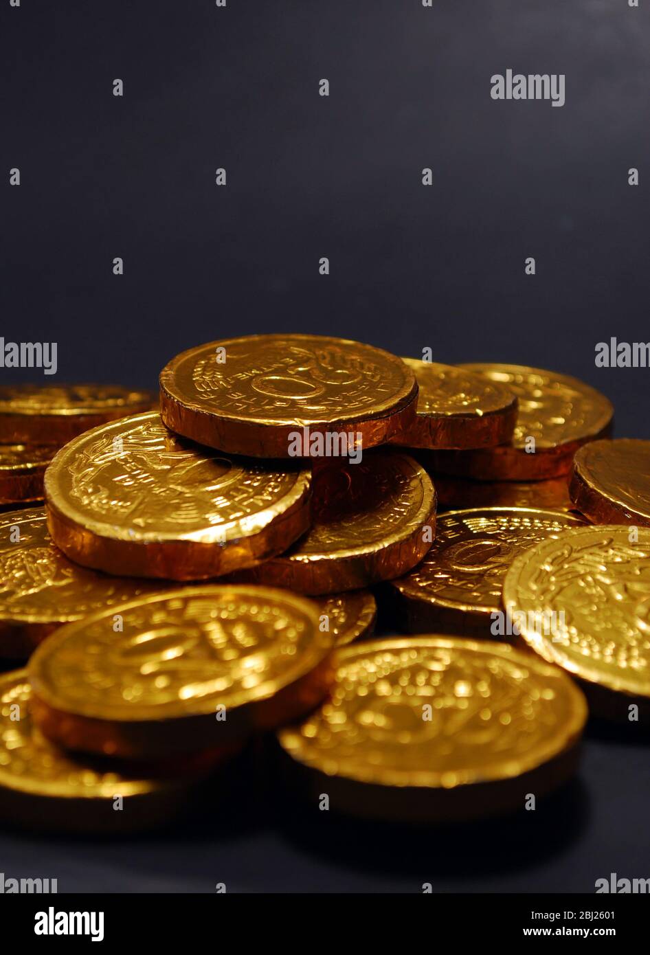 Gold coin chocolate food replica Stock Photo - Alamy