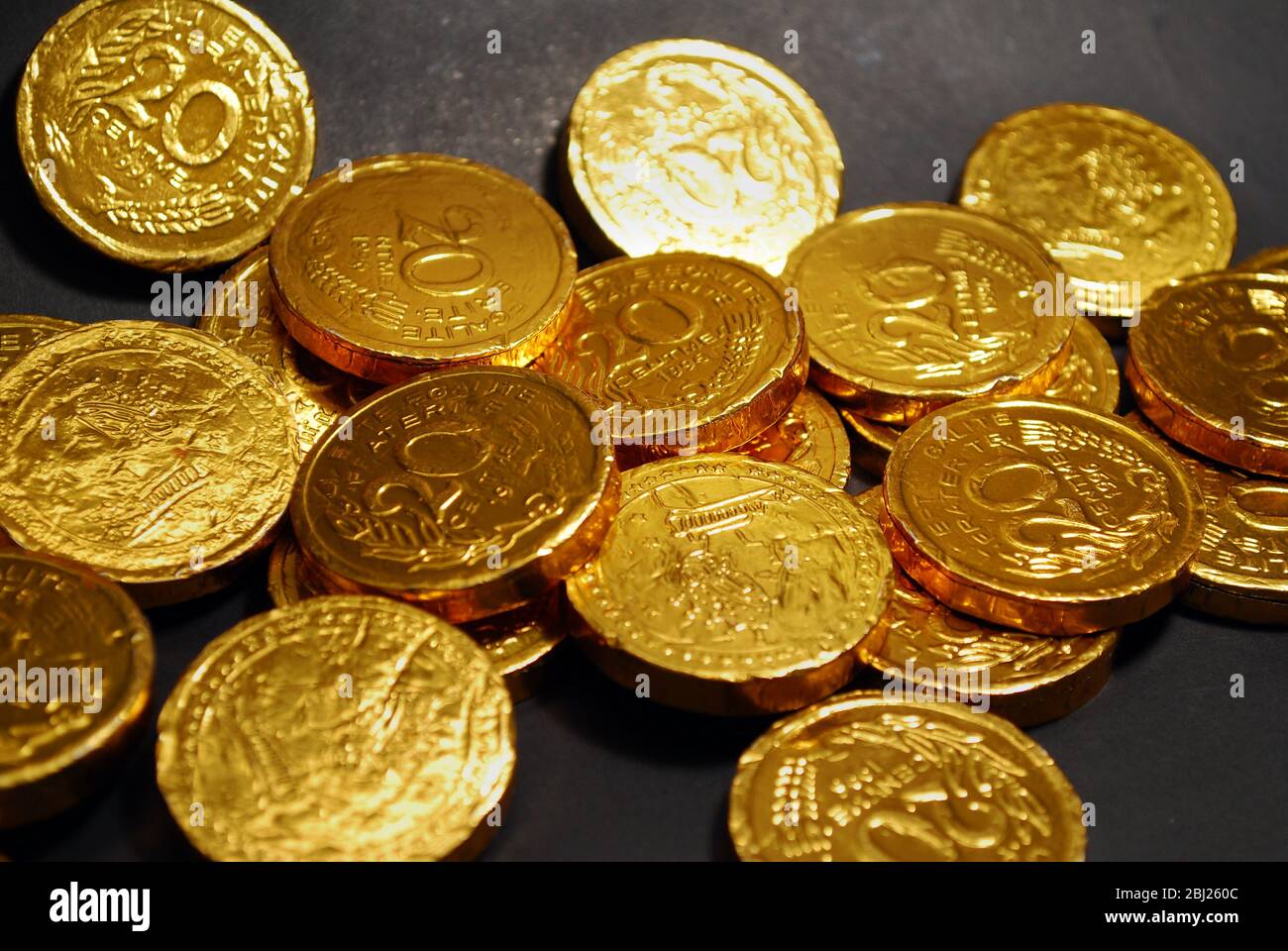 Gold coin chocolate food replica Stock Photo - Alamy